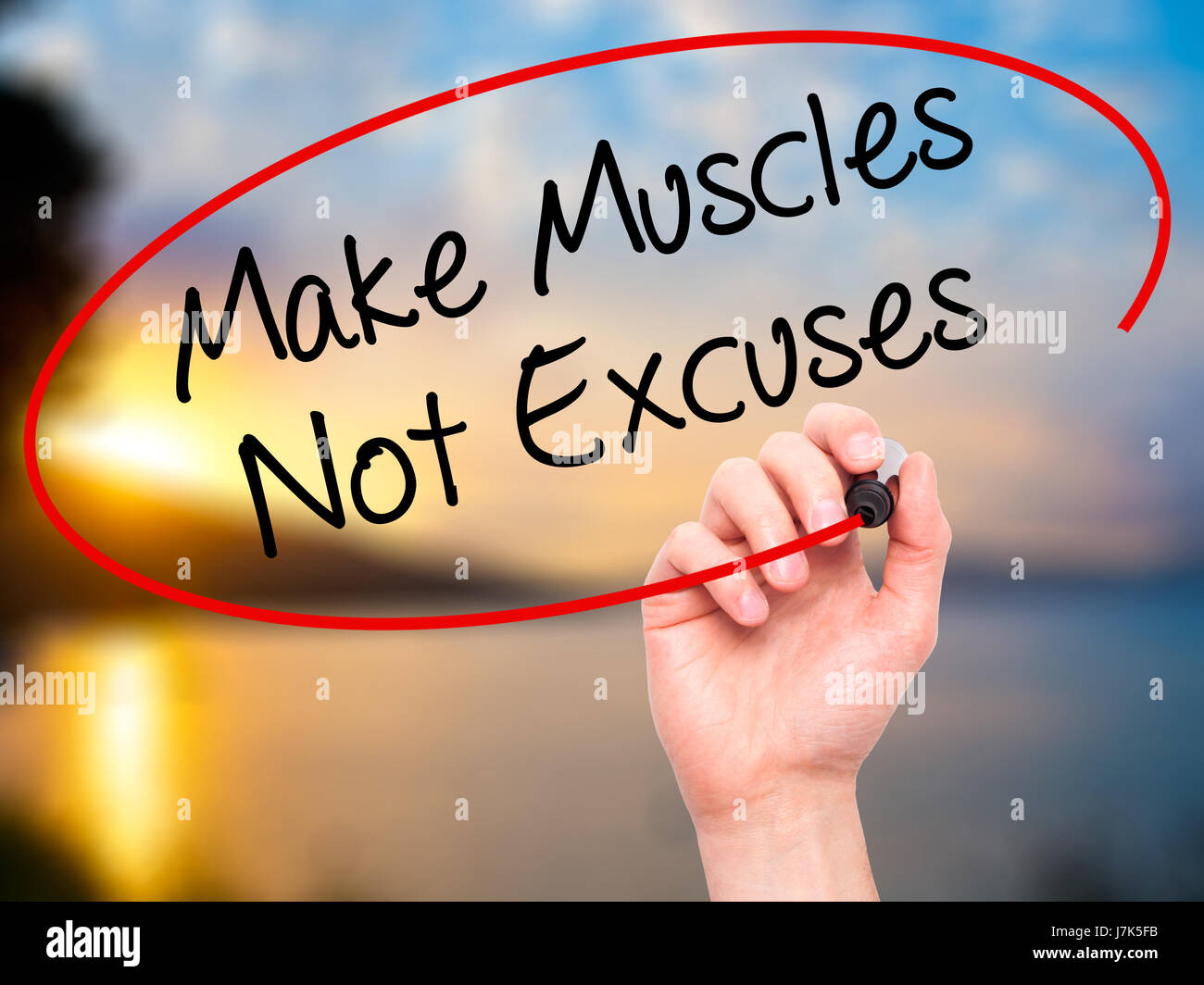 Man Hand writing Make Muscles Not Excuses with black marker on visual ...