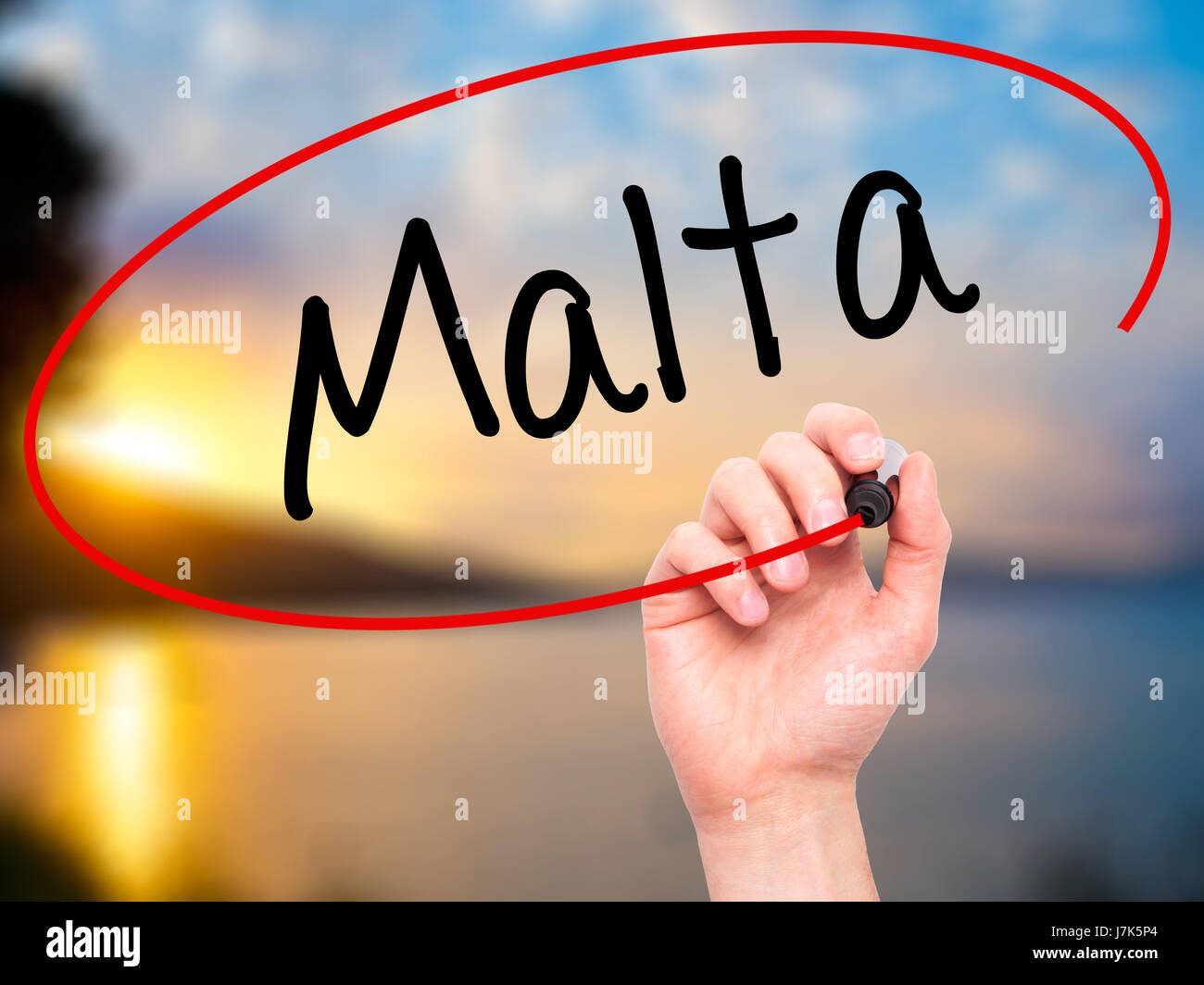 Man Hand writing Malta with black marker on visual screen. Isolated on ...