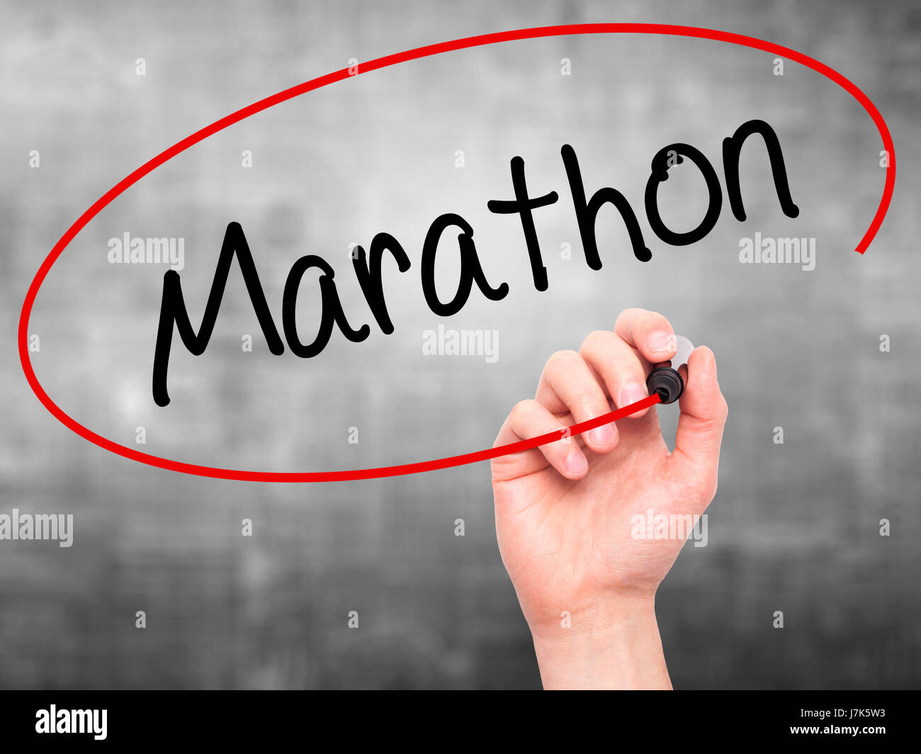 Man Hand writing Marathon with black marker on visual screen. Isolated ...