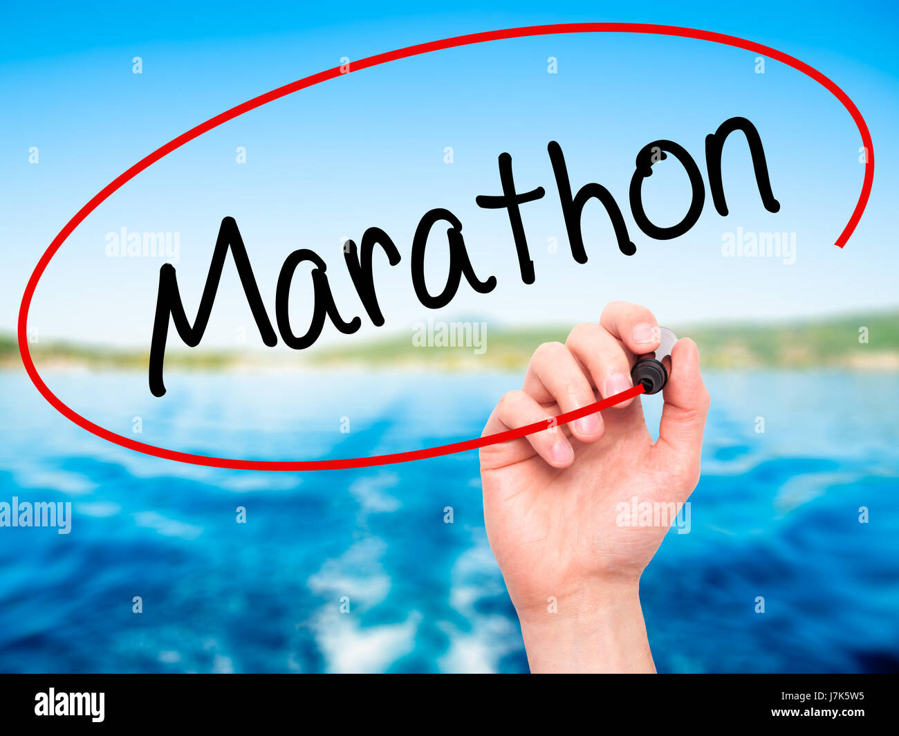 Man Hand writing Marathon with black marker on visual screen. Isolated ...