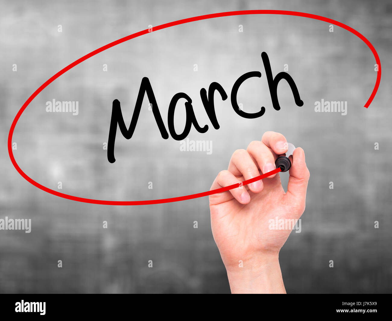Man Hand writing March with black marker on visual screen. Isolated on ...