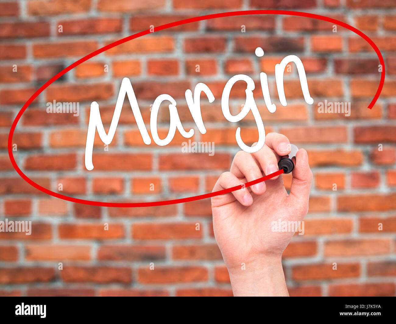 Man Hand writing Margin with black marker on visual screen. Isolated on ...