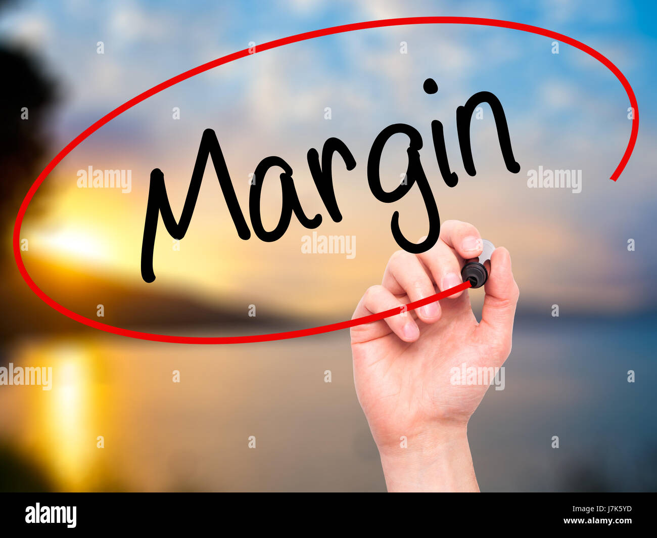 Man Hand writing Margin with black marker on visual screen. Isolated on ...