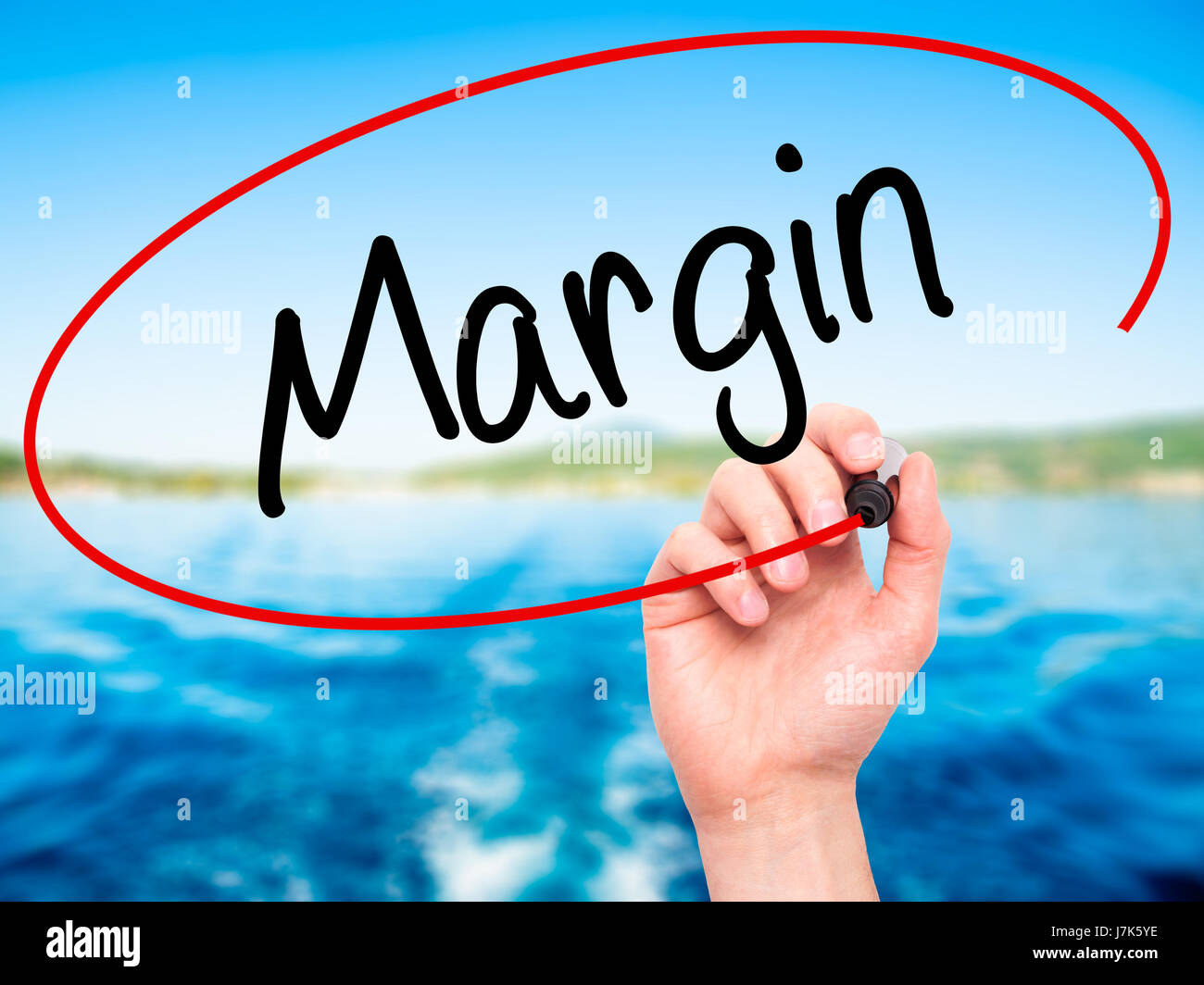 Man Hand writing Margin with black marker on visual screen. Isolated on ...
