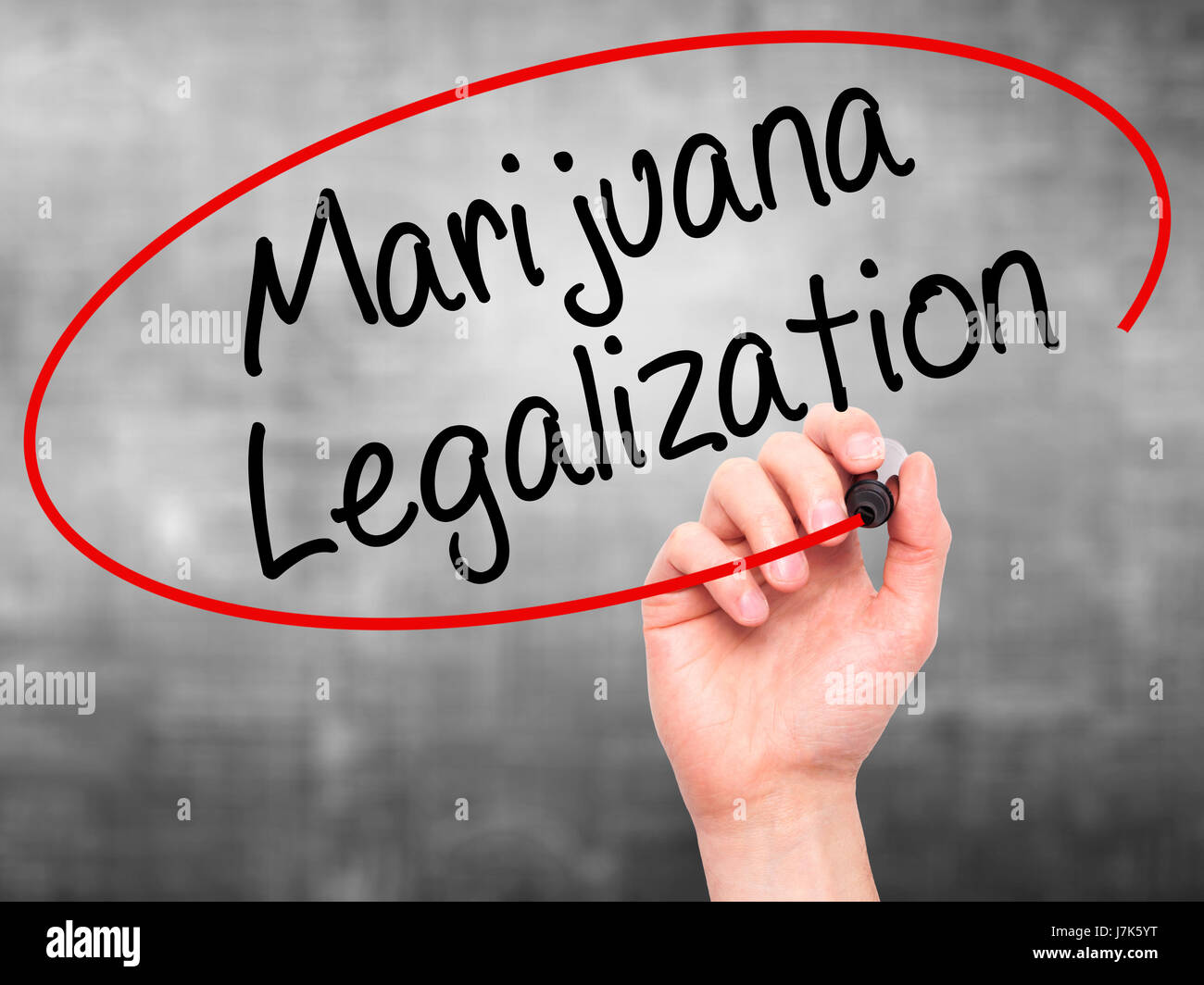 Man Hand writing Marijuana Legalization with black marker on visual ...