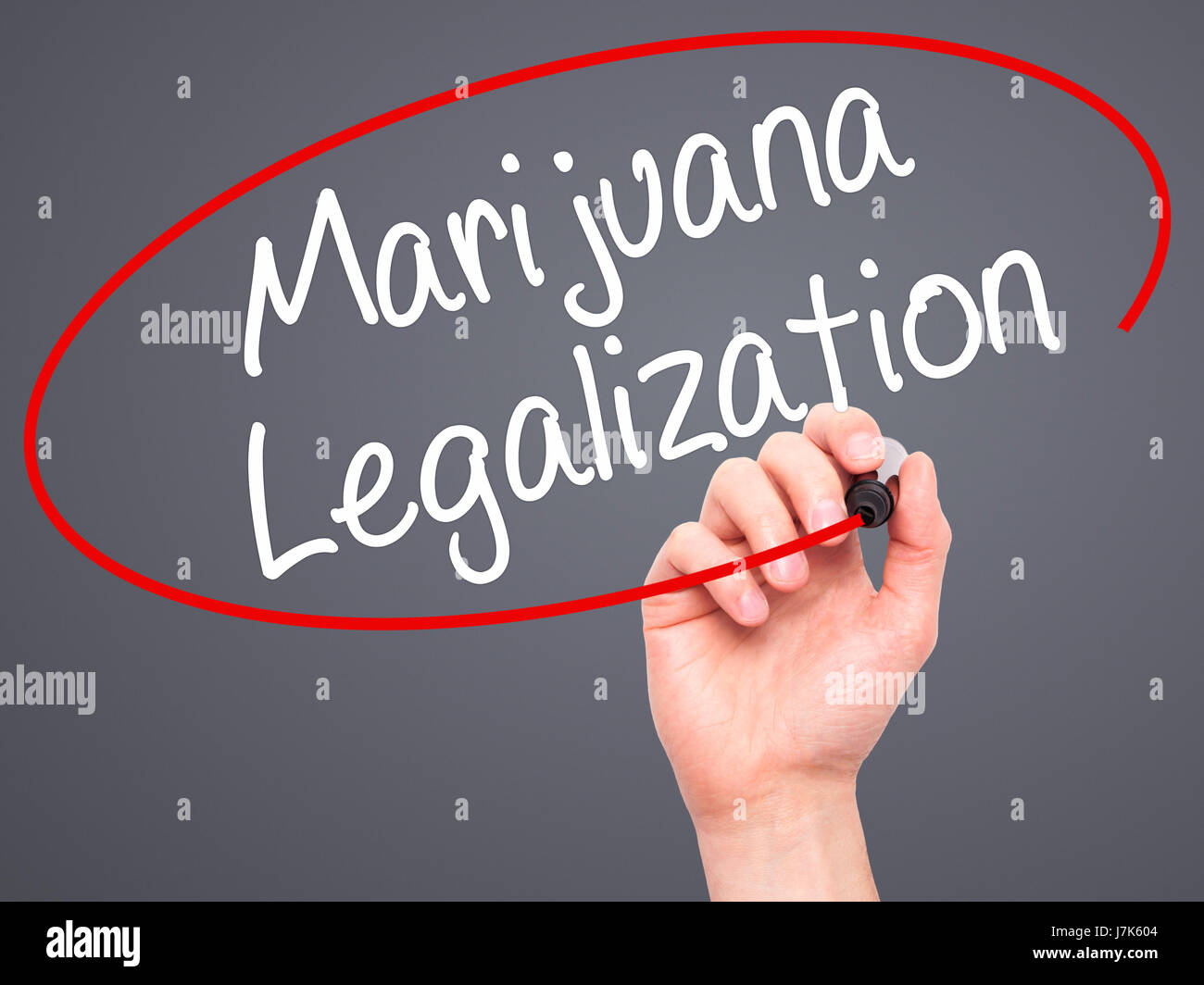 Man Hand writing Marijuana Legalization with black marker on visual ...