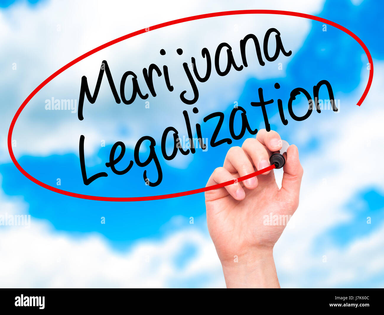 Man Hand writing Marijuana Legalization with black marker on visual ...
