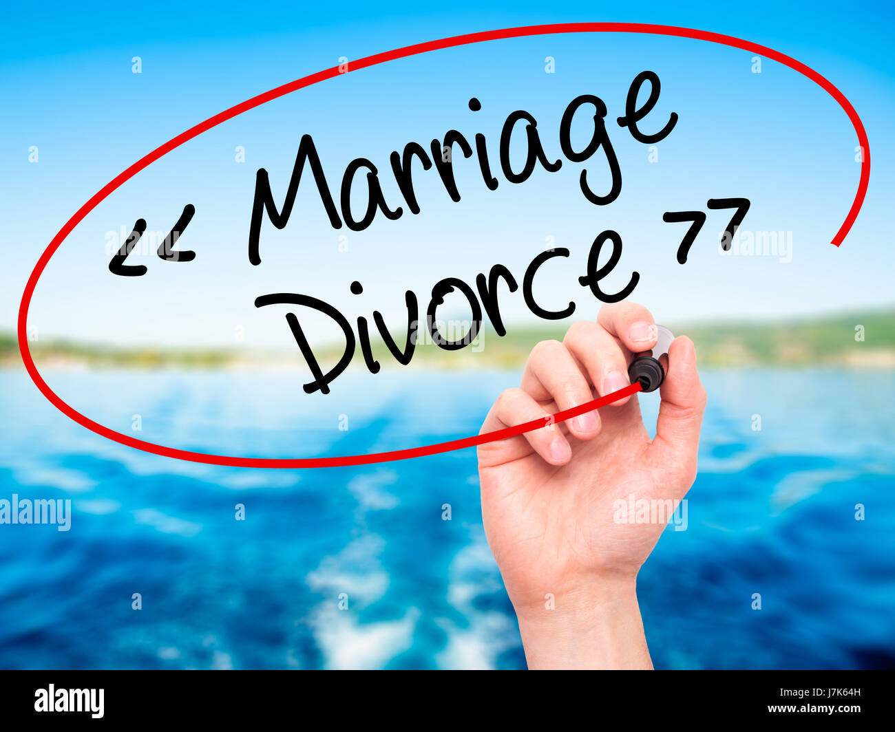 Man Hand writing Marriage - Divorce with black marker on visual screen ...