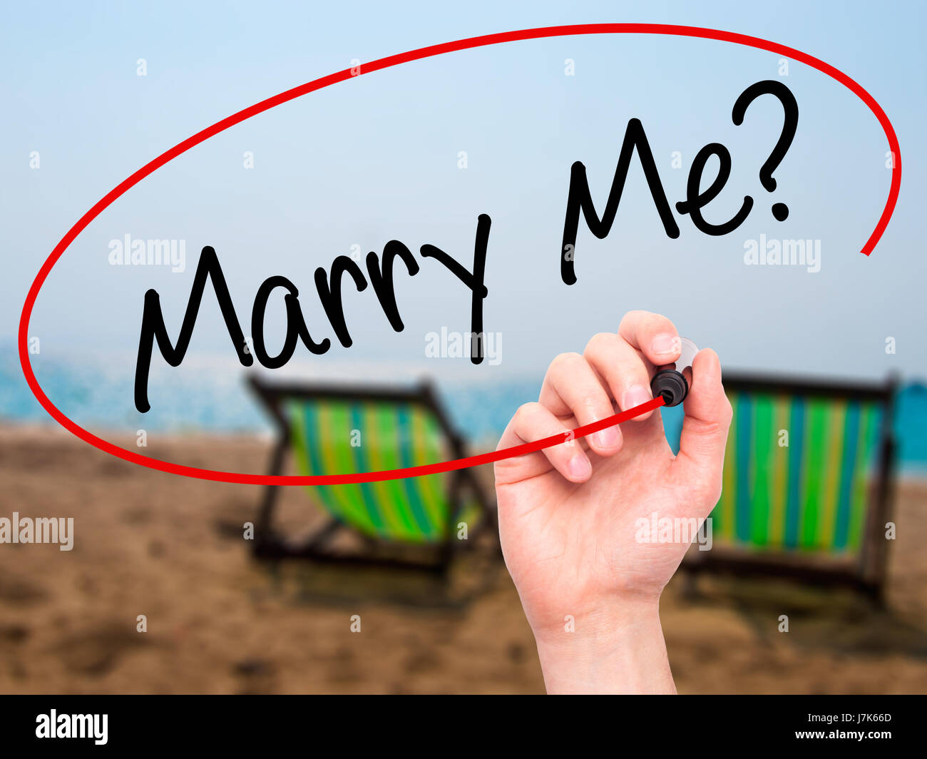Man Hand writing Marry Me? with black marker on visual screen. Isolated ...