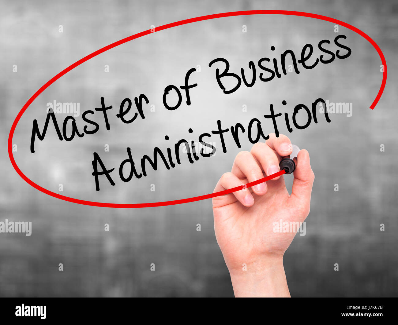 Man Hand writing Master of Business Administration with black marker on ...