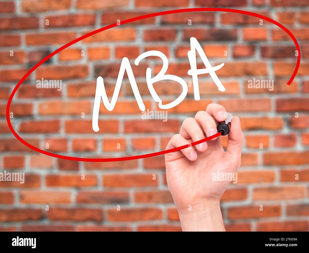Man Hand writing MBA with black marker on visual screen. Isolated on ...