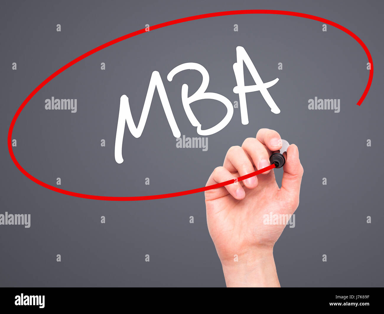 Man Hand writing MBA with black marker on visual screen. Isolated on ...