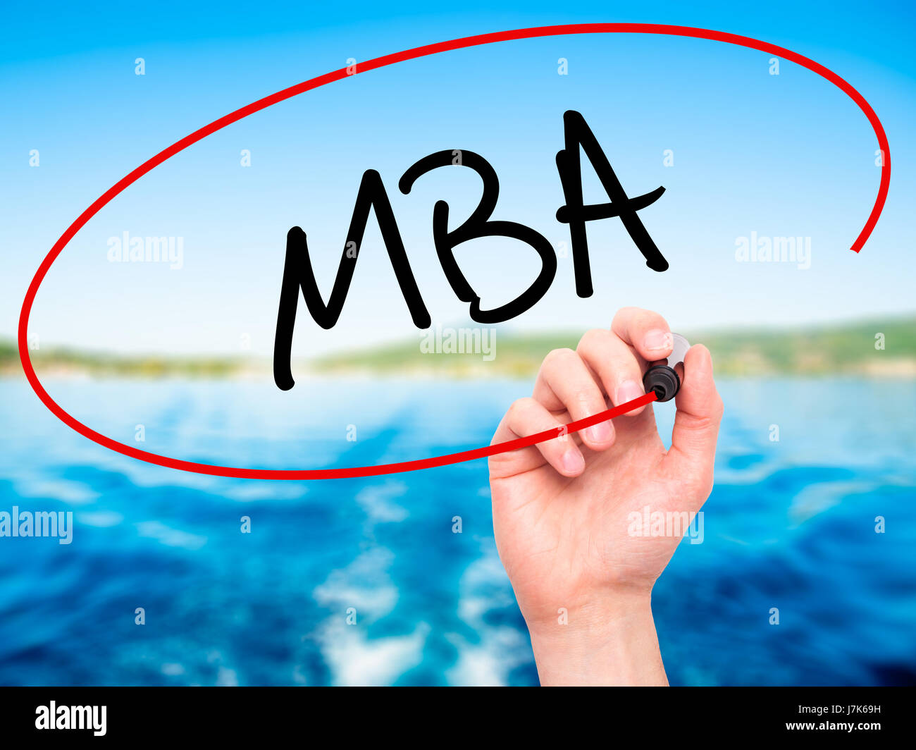 Man Hand writing MBA with black marker on visual screen. Isolated on ...