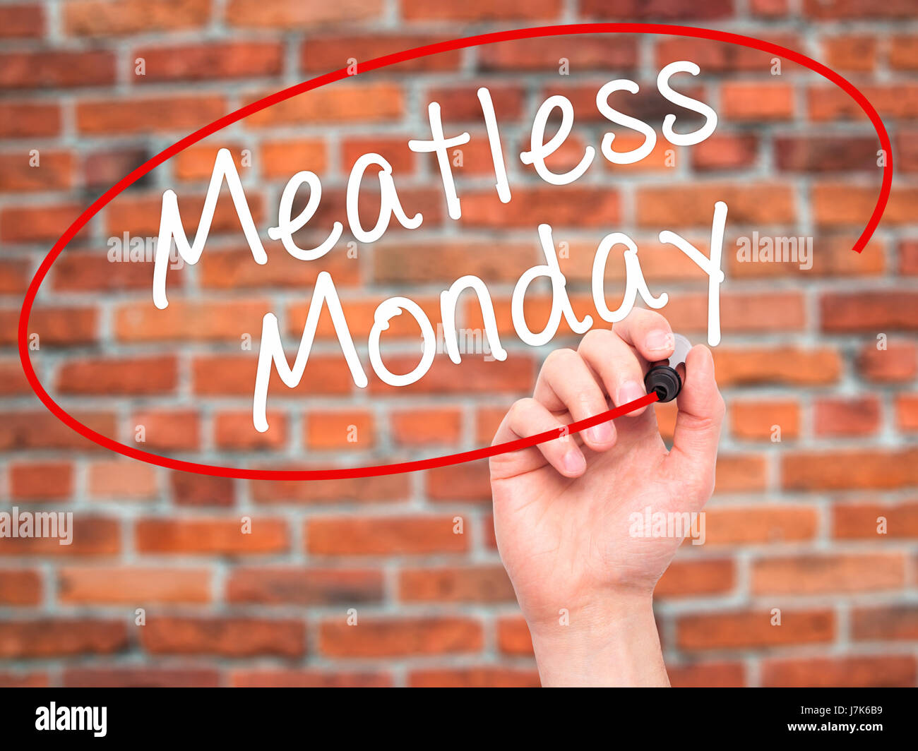 Man Hand writing Meatless Monday with black marker on visual screen ...