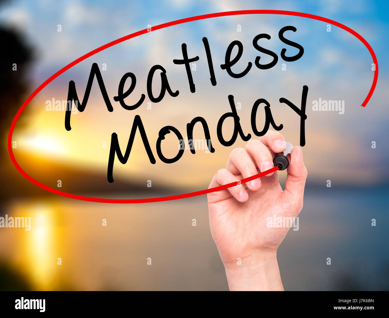 Man Hand writing Meatless Monday with black marker on visual screen ...