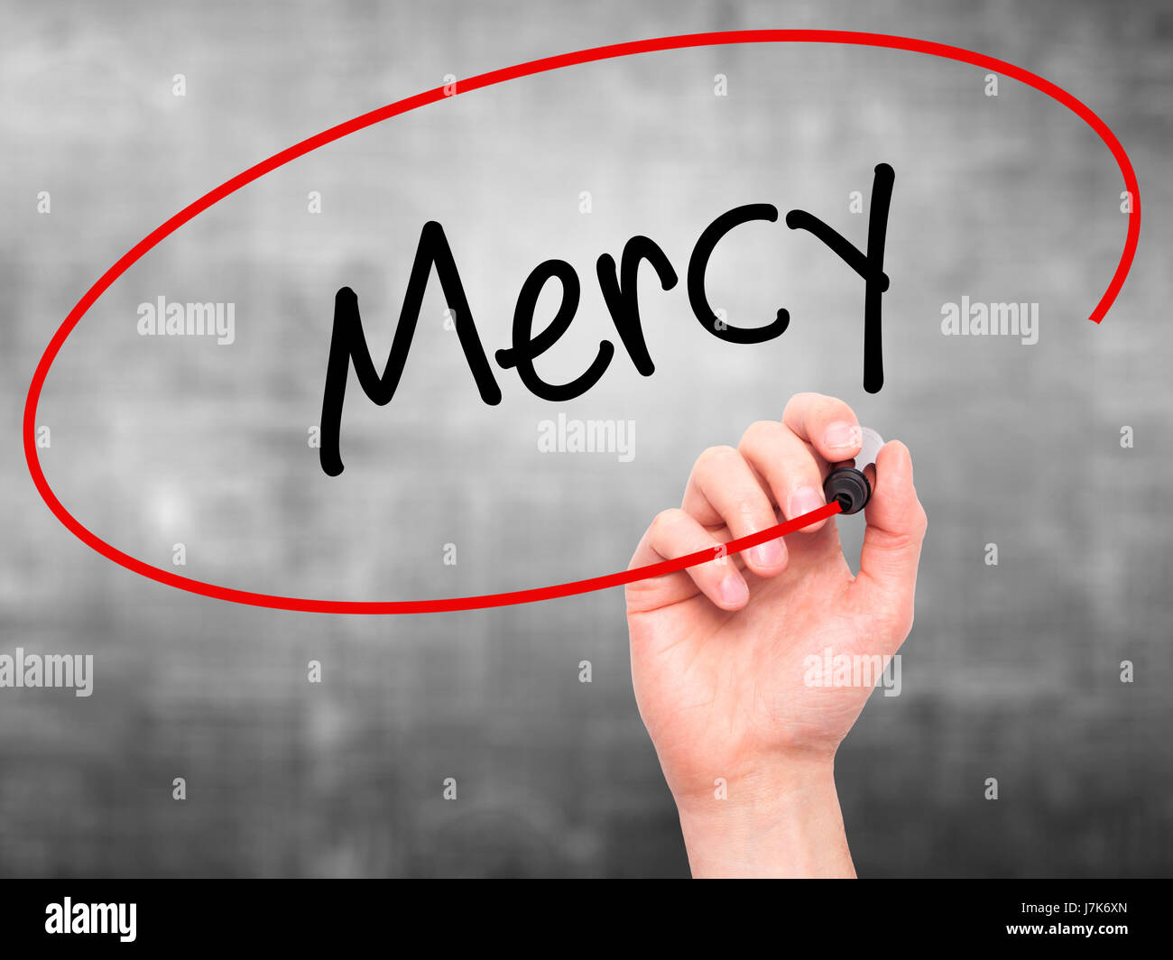 Man Hand writing Mercy with black marker on visual screen. Isolated on ...