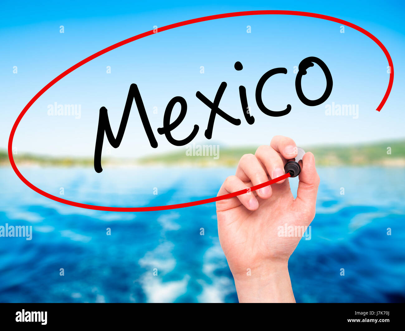 Man Hand writing Mexico with black marker on visual screen. Isolated on ...