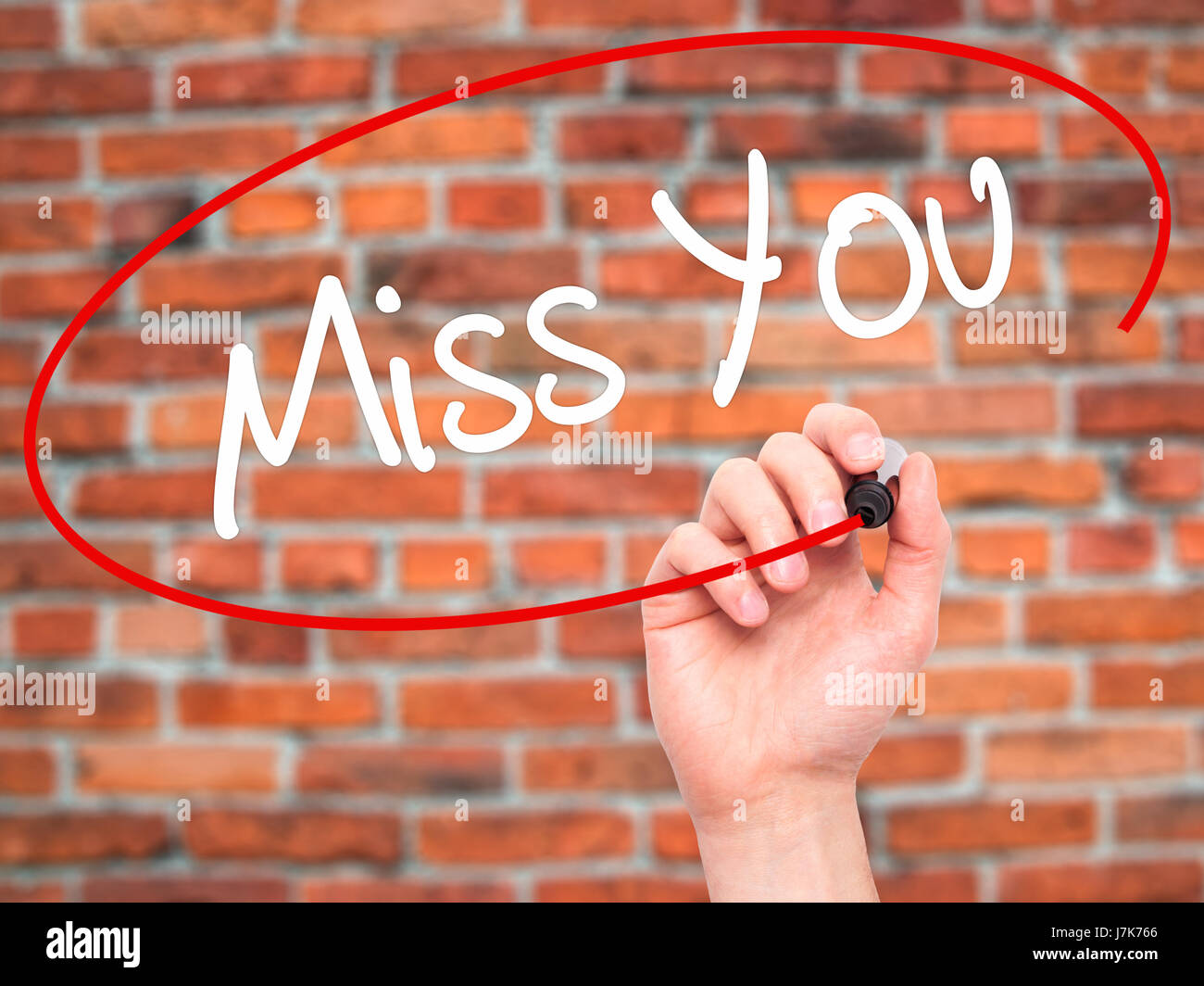 Man Hand writing Miss You with black marker on visual screen. Isolated ...