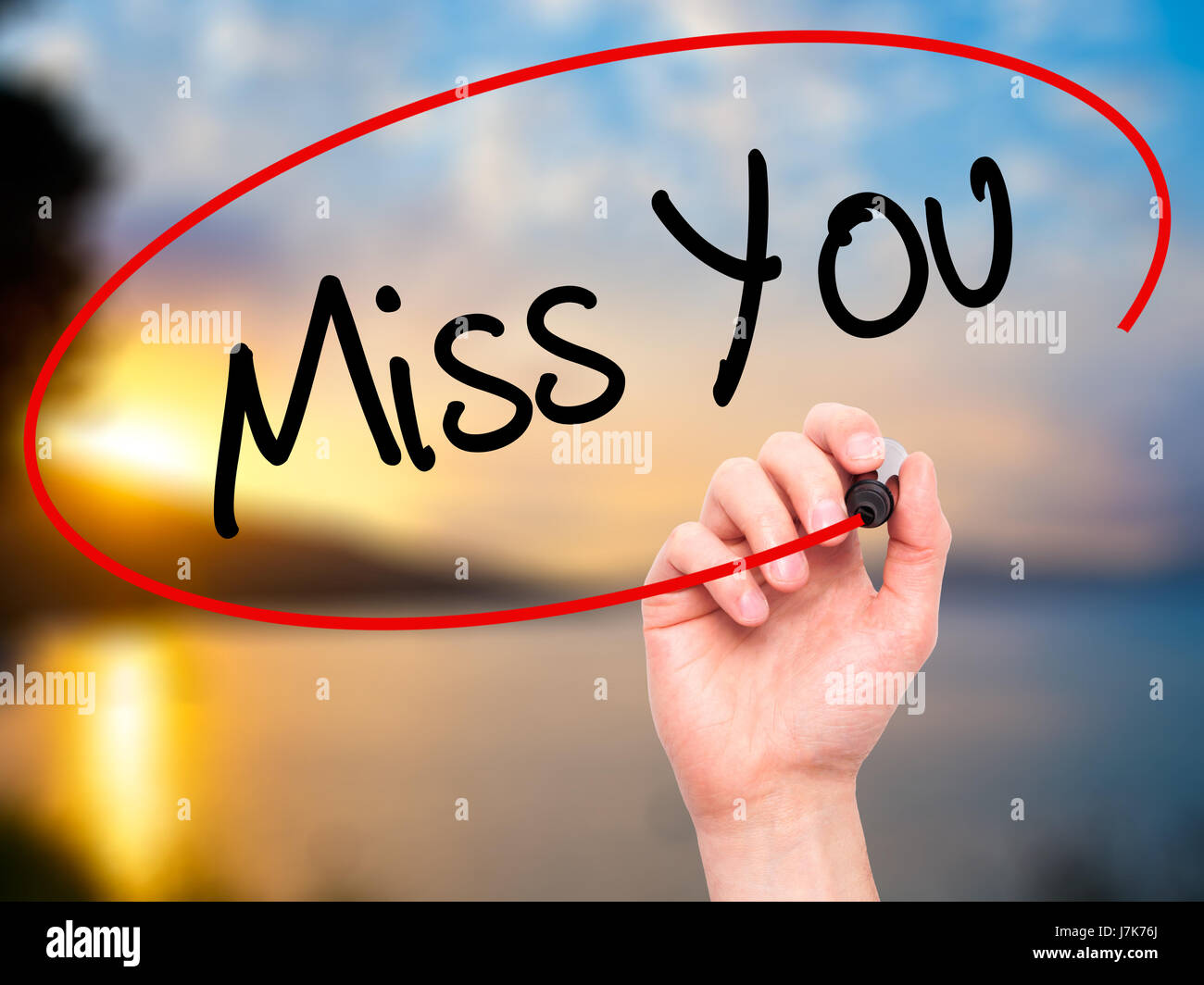 Man Hand writing Miss You with black marker on visual screen. Isolated ...