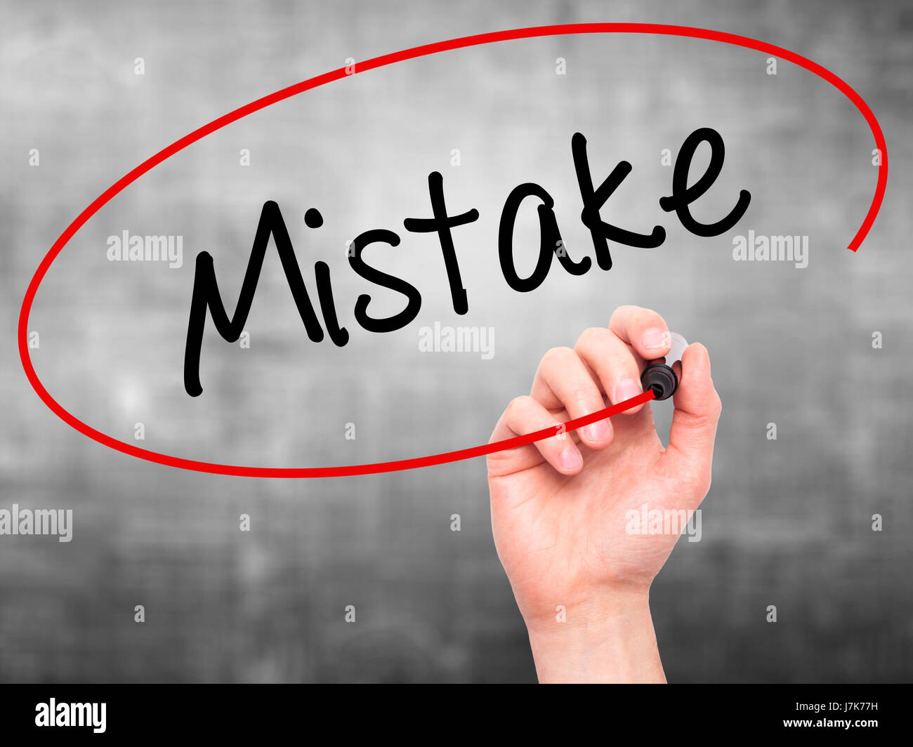 Man Hand writing Mistake with black marker on visual screen. Isolated ...