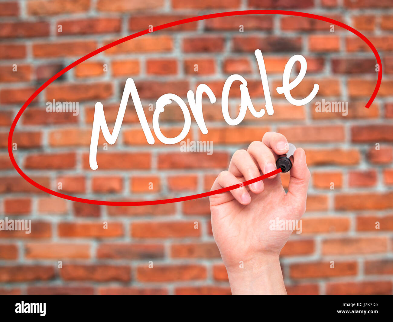 Man Hand writing Morale with black marker on visual screen. Isolated on ...