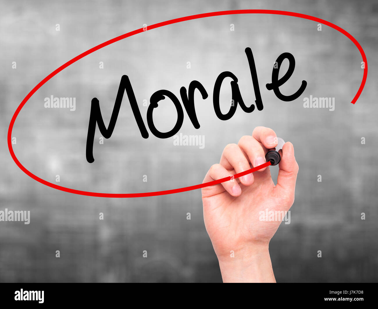 Man Hand writing Morale with black marker on visual screen. Isolated on ...