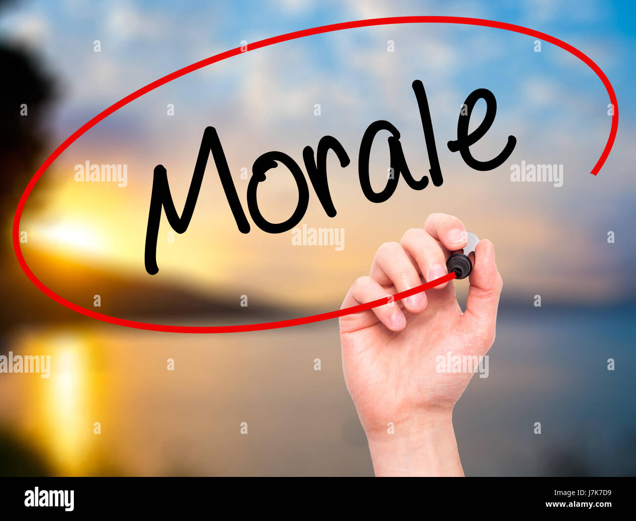 Man Hand writing Morale with black marker on visual screen. Isolated on ...