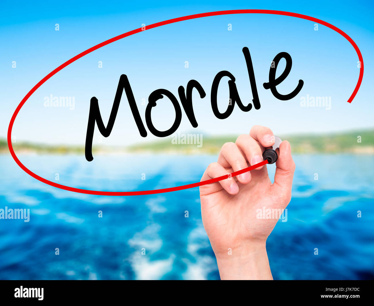 Man Hand writing Morale with black marker on visual screen. Isolated on ...