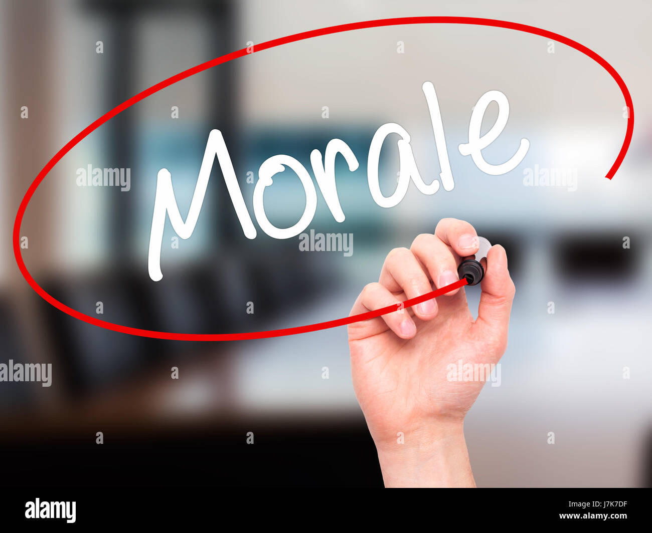 Man Hand writing Morale with black marker on visual screen. Isolated on ...