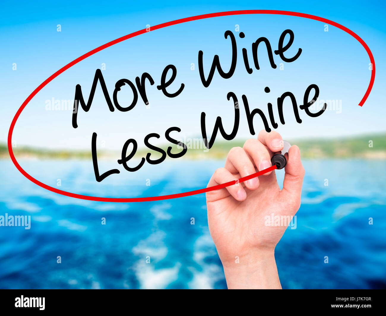 Man Hand writing More Wine Less Whine with black marker on visual ...
