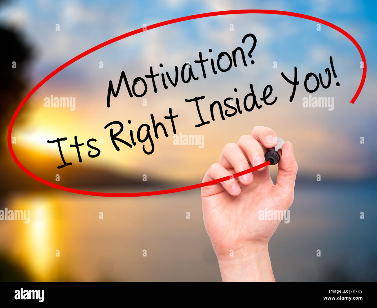 Man Hand writing Motivation? Its Right Inside You! with black marker on ...