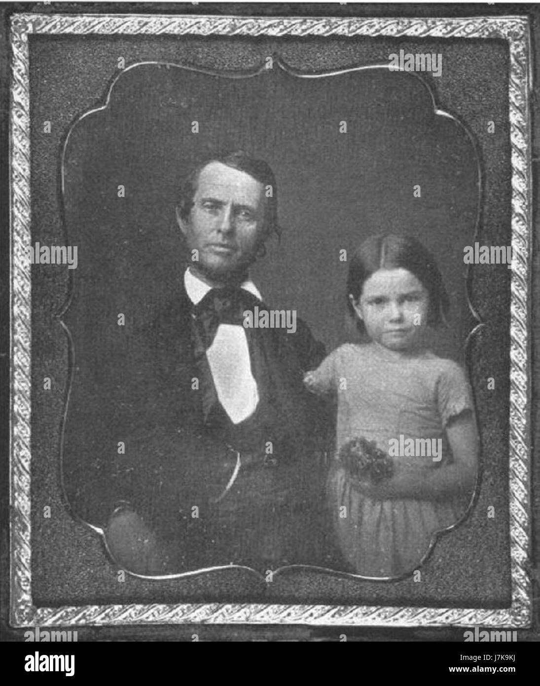Amos Starr Cooke, an American missionary, is depicted with his daughter ...