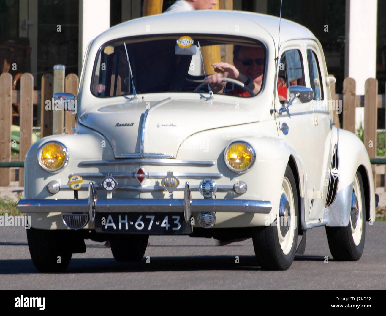 This image showcases a 1960 Renault 4, a French compact car known for ...