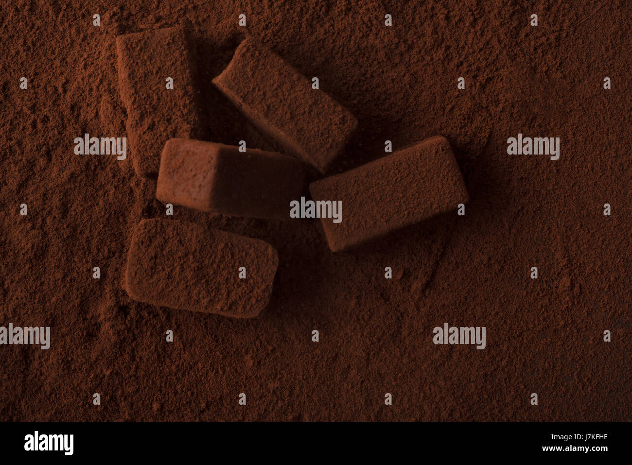 Close-up of dark natural pile of chocolate candies covered in chocolate ...