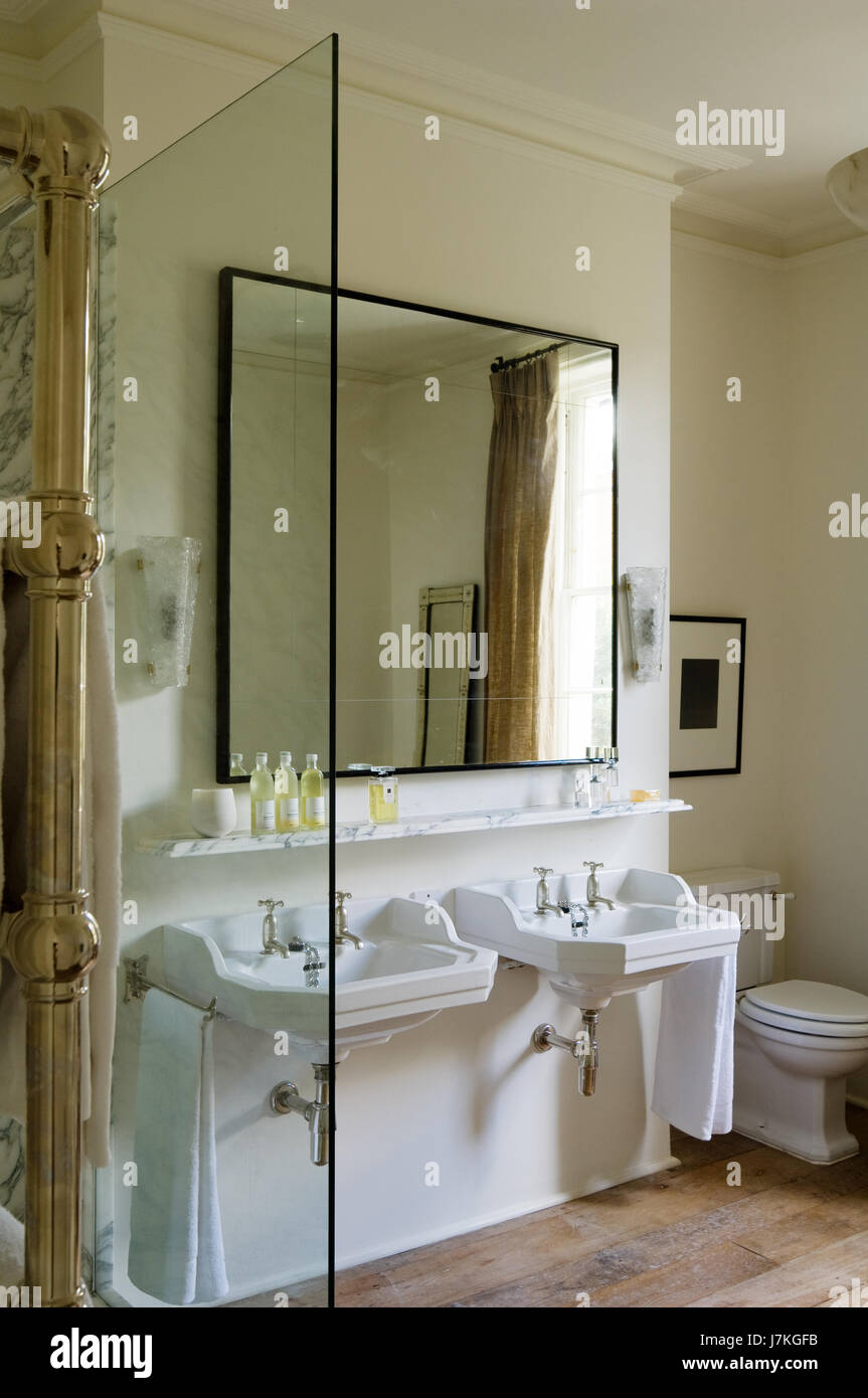 Large mirror above double hand-basins in Portland Road, London, UK ...