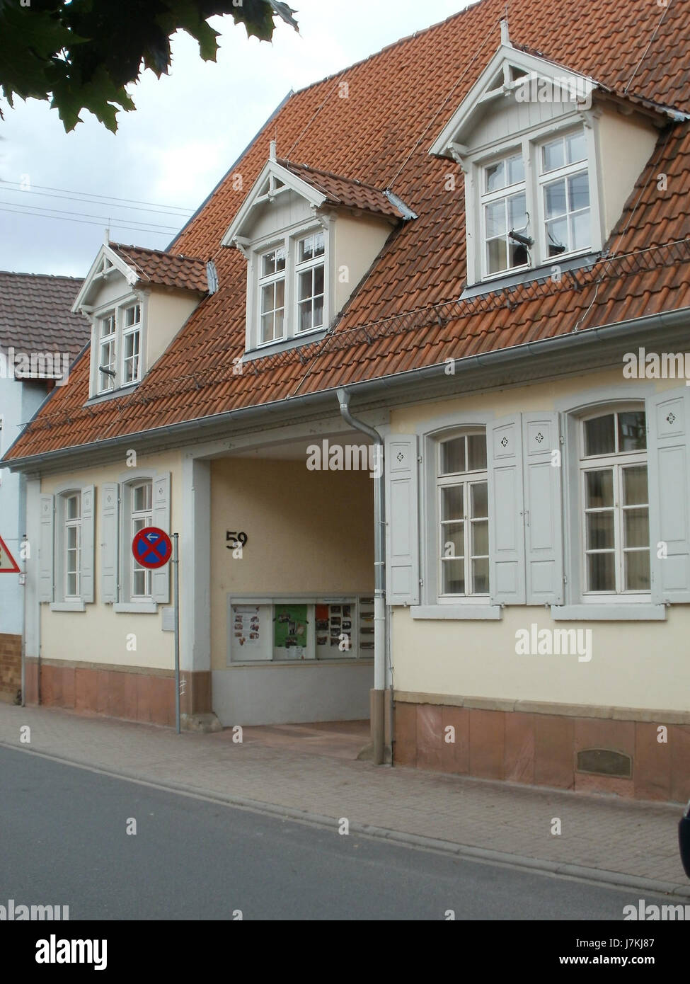 This image captures a street view of Mannheimer Str. 59 in Oftersheim ...
