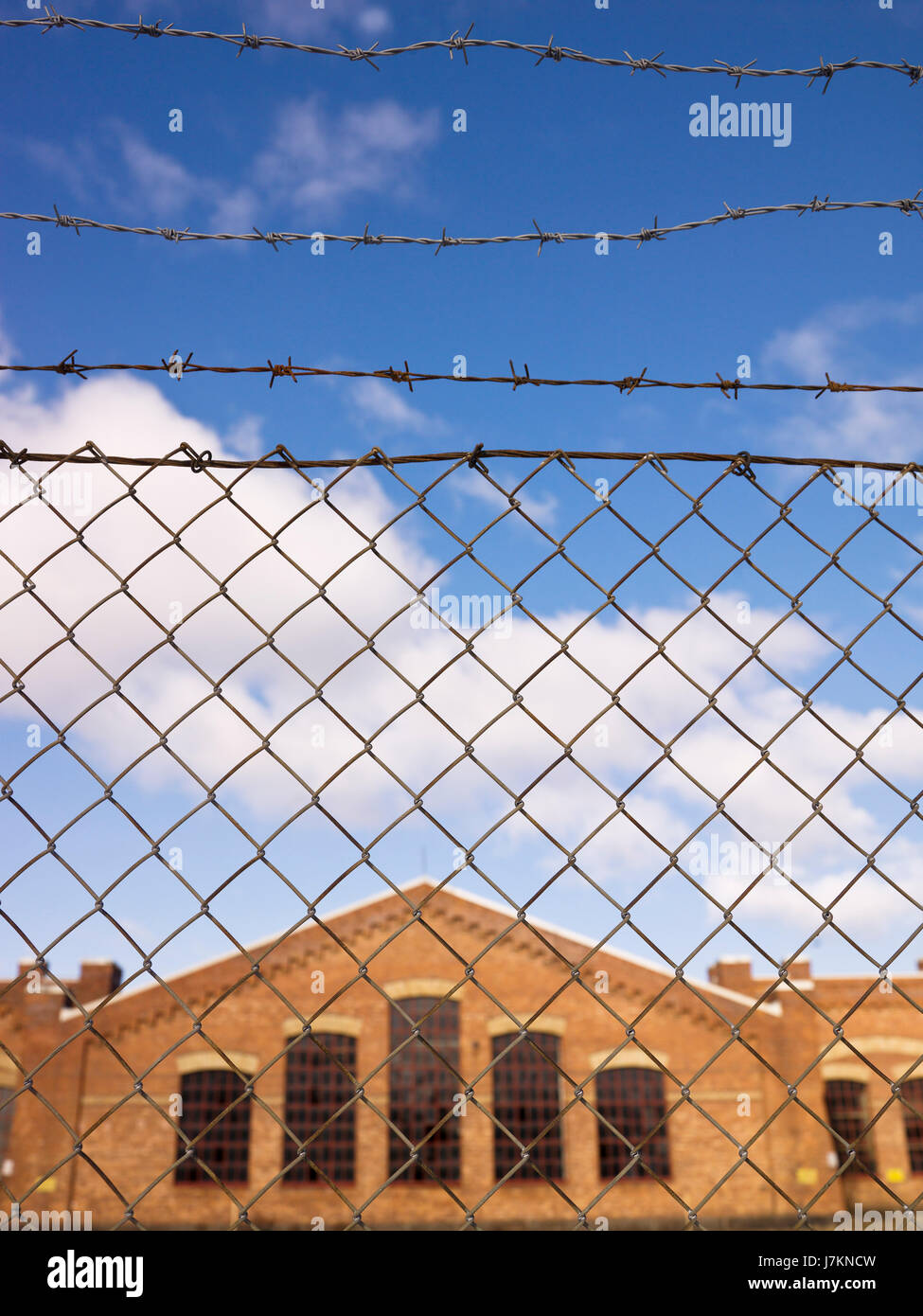 blue industry cloud vintage closed brig jail fence fence in fencing ...