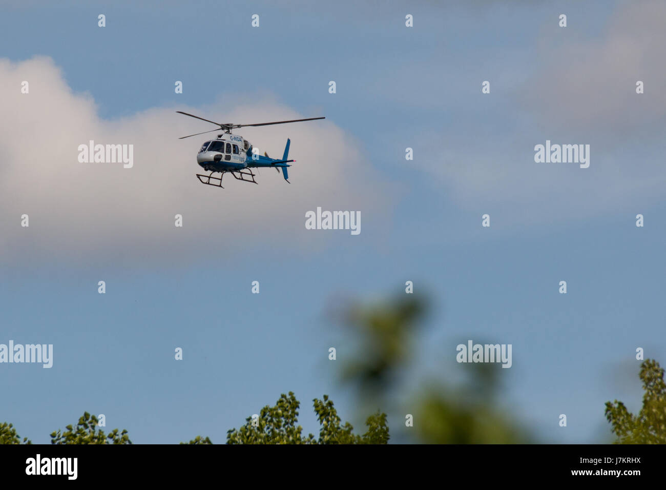 White blue helicopter flying hi-res stock photography and images - Alamy