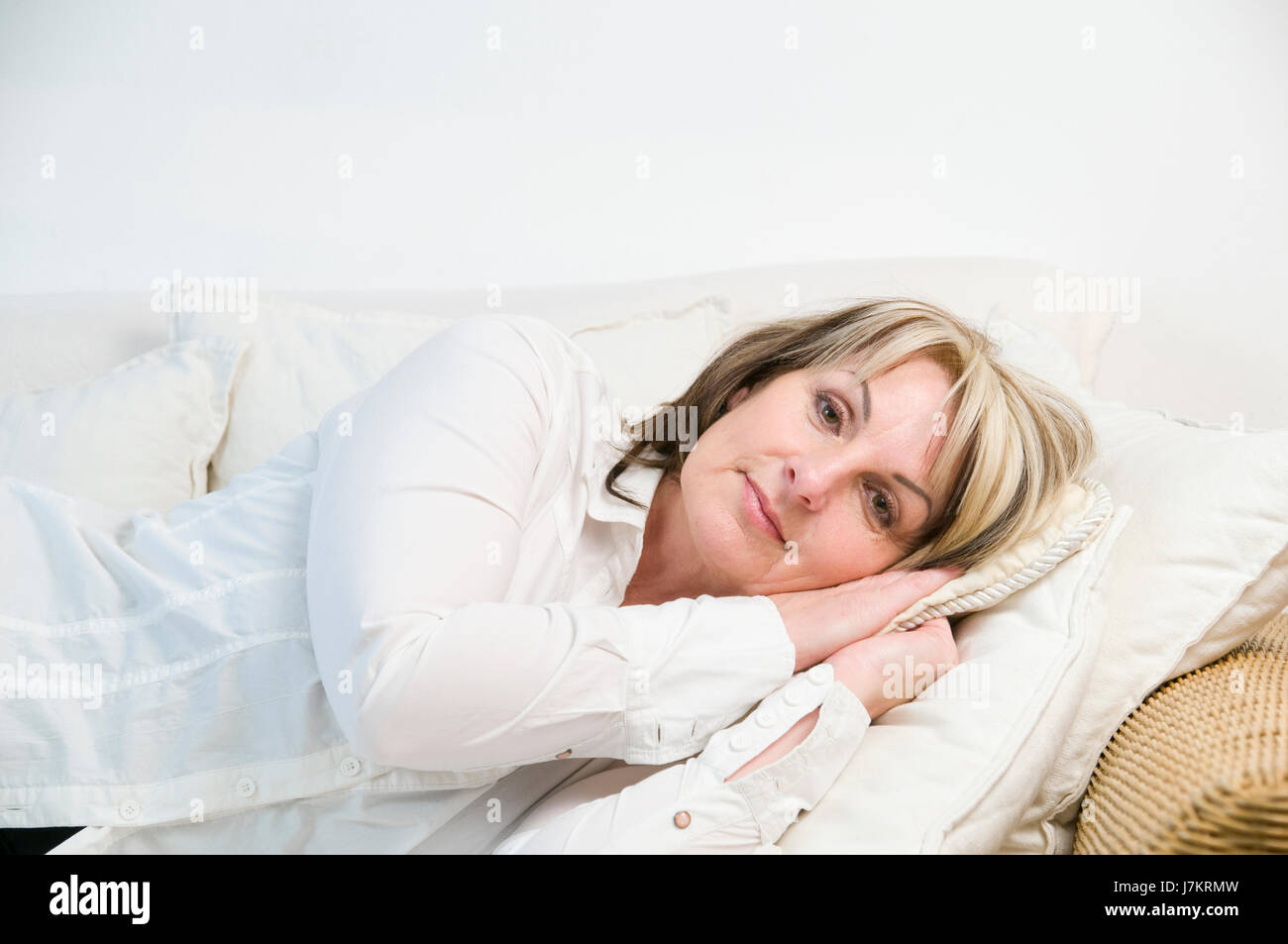 woman person lie lying lies adult couch woman laugh laughs laughing ...