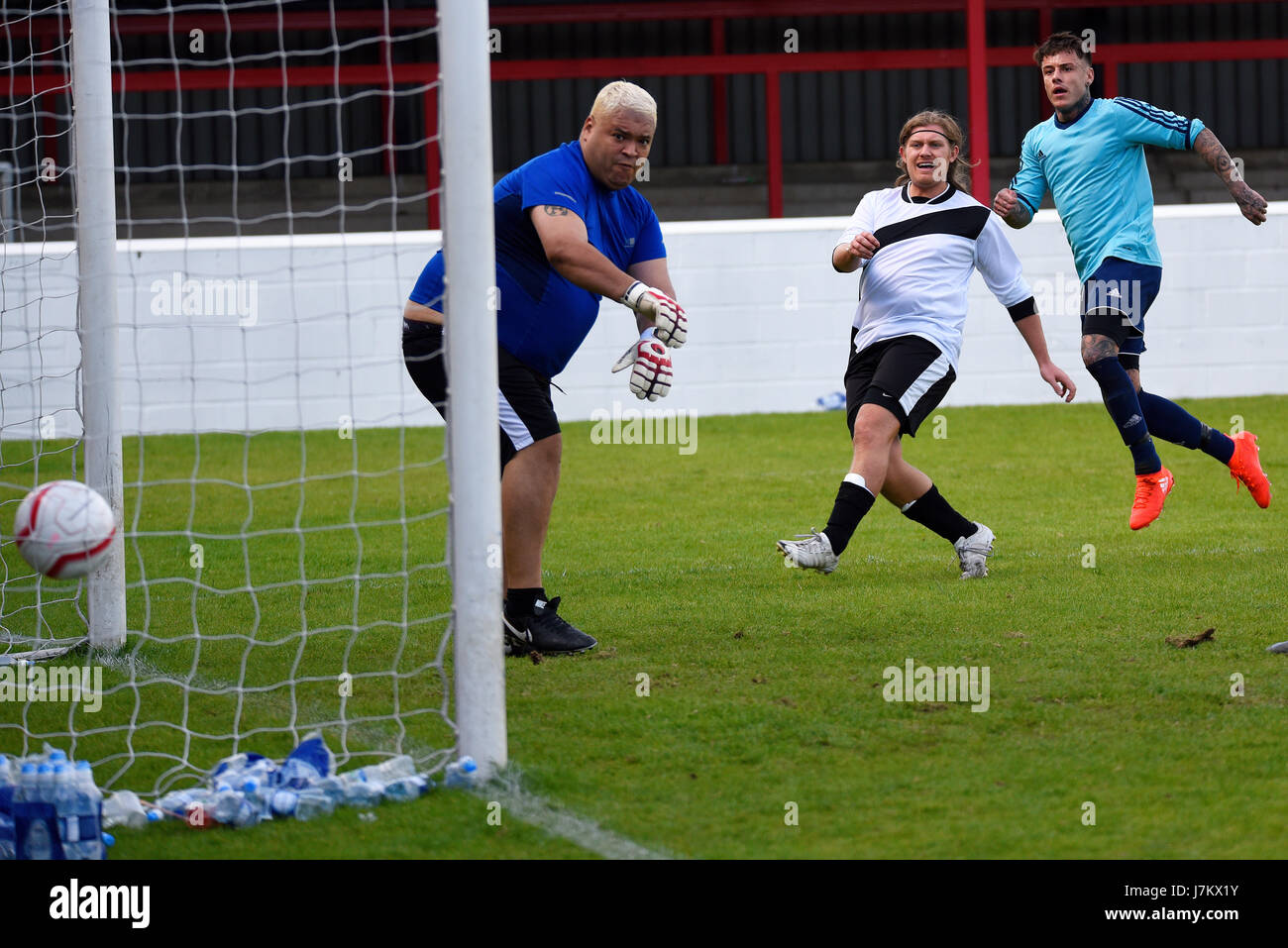 Heavy D, Harry Berry and Chet Johnson playing in a charity football ...