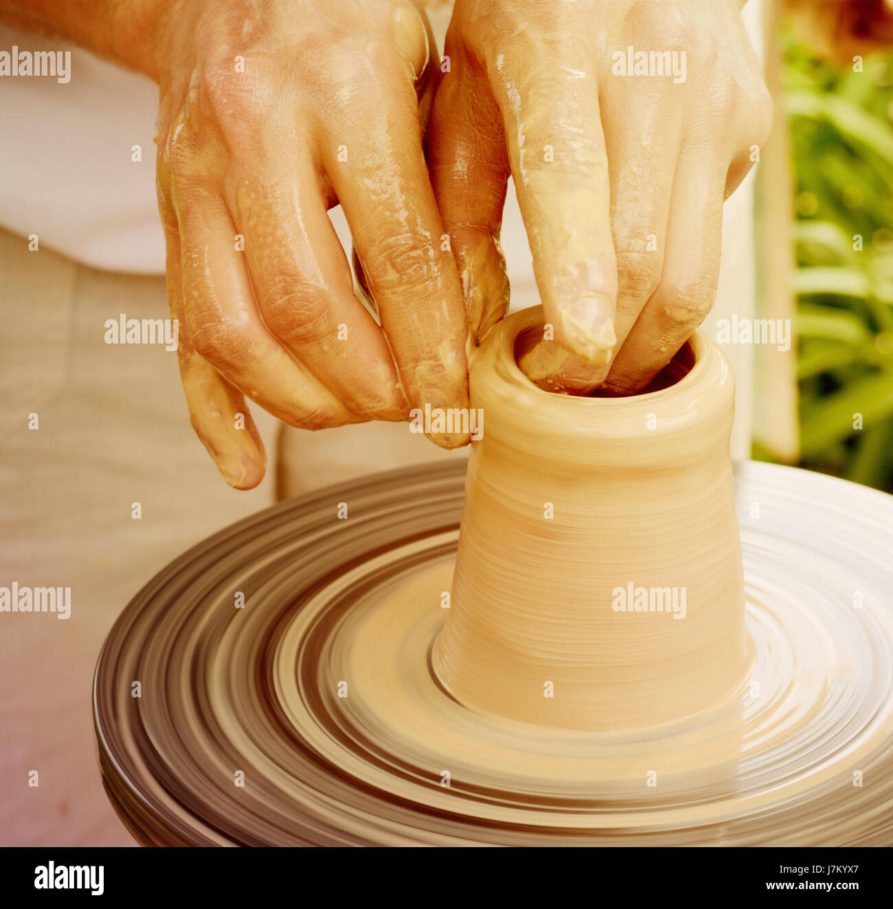 Male potter makes vessel with pottery wheel Stock Photo - Alamy