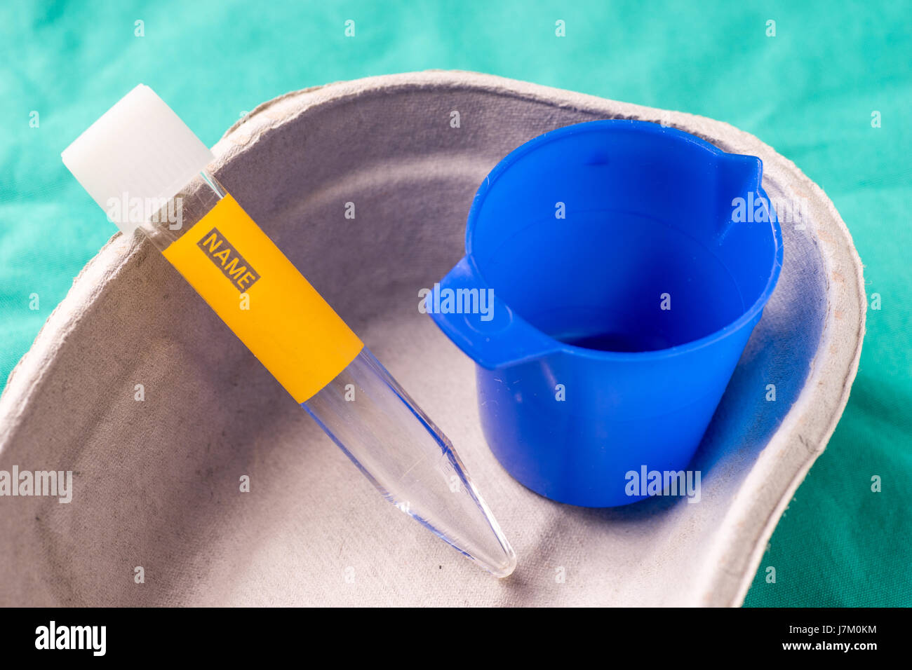 Medical test tube for urine sample lying in a one use capsule on the ...