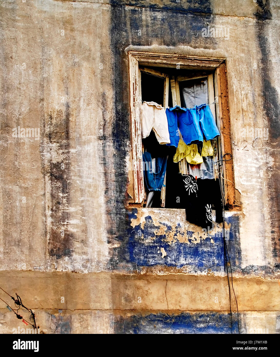 city town window porthole dormer window pane wall wet facade slum ...