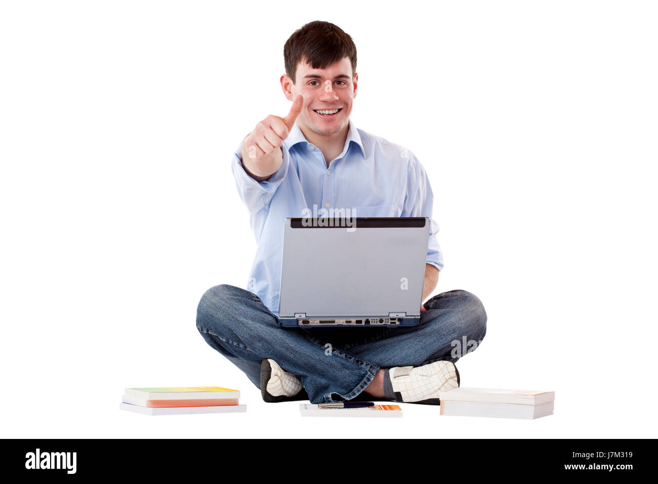 successful student with computer shows thumb Stock Photo - Alamy