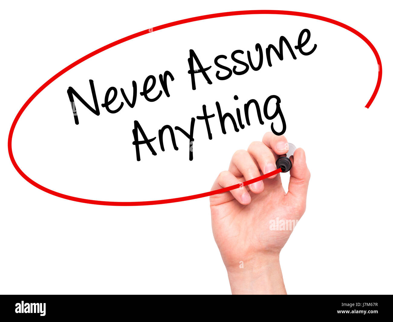Man Hand writing Never Assume Anything with black marker on visual ...