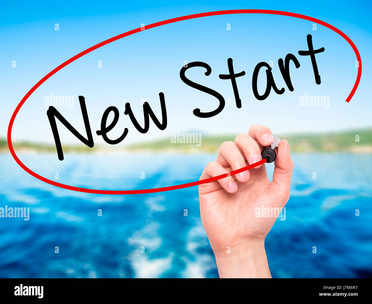 Man Hand writing New Start with black marker on visual screen. Isolated ...