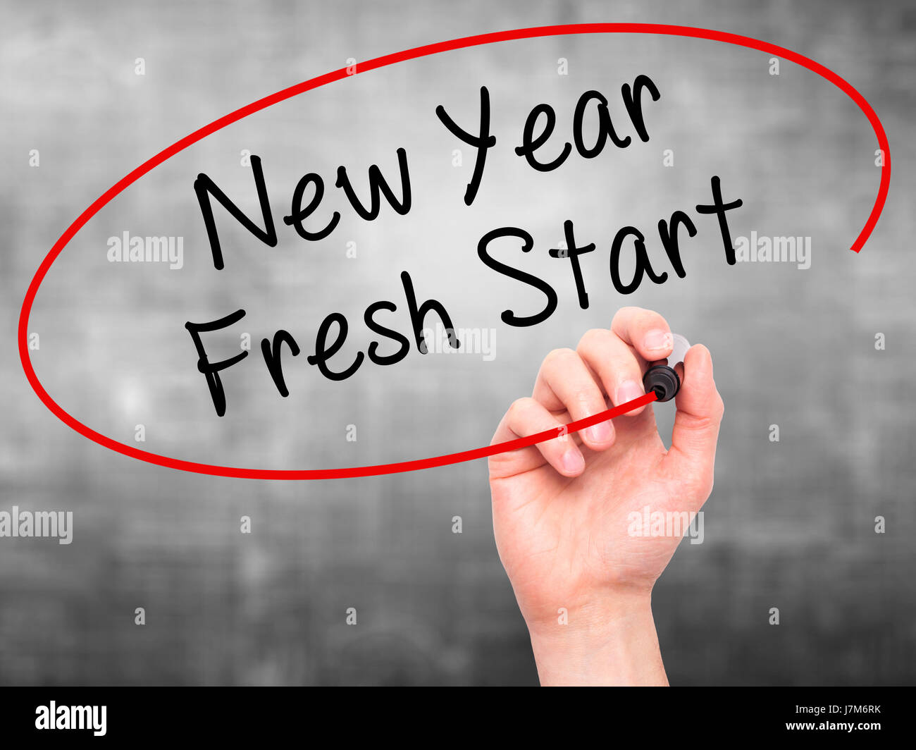 Man Hand writing New Year Fresh Start with black marker on visual ...
