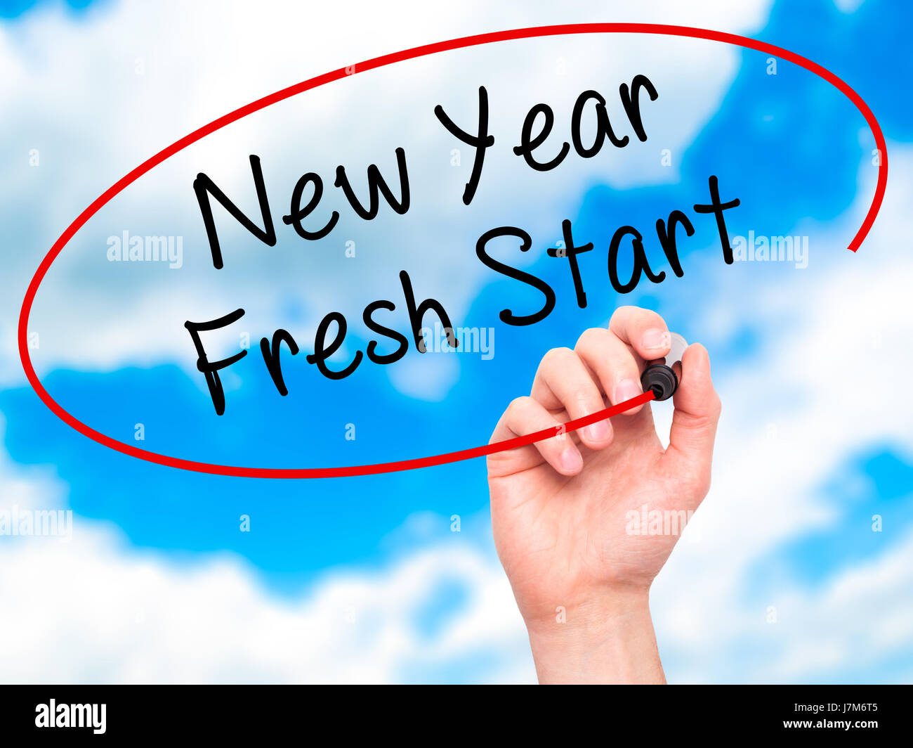 Man Hand writing New Year Fresh Start with black marker on visual ...