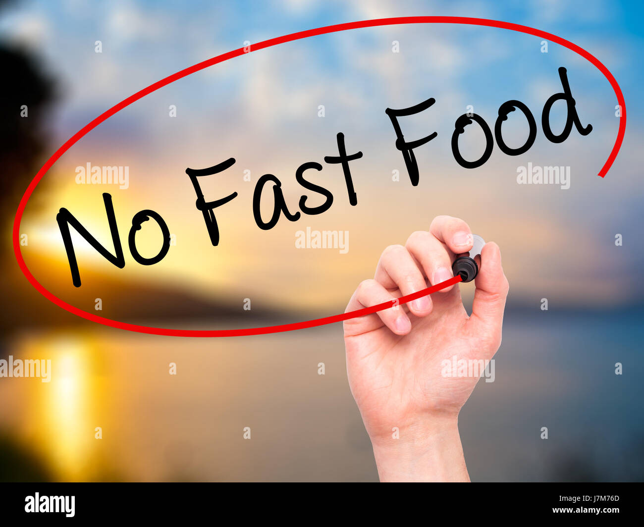 Man Hand writing No Fast Food with black marker on visual screen ...