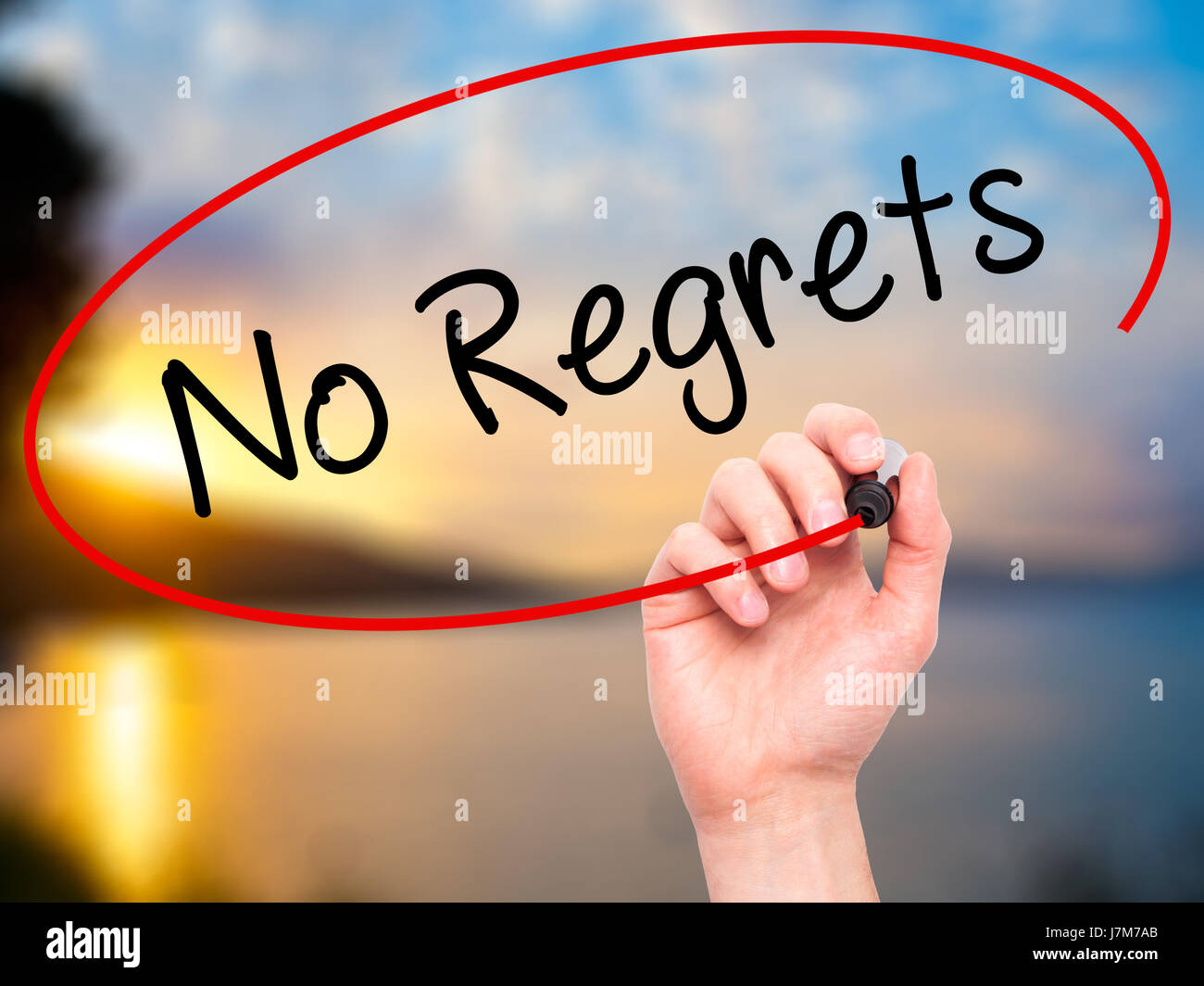 Man Hand writing No Regrets with black marker on visual screen ...